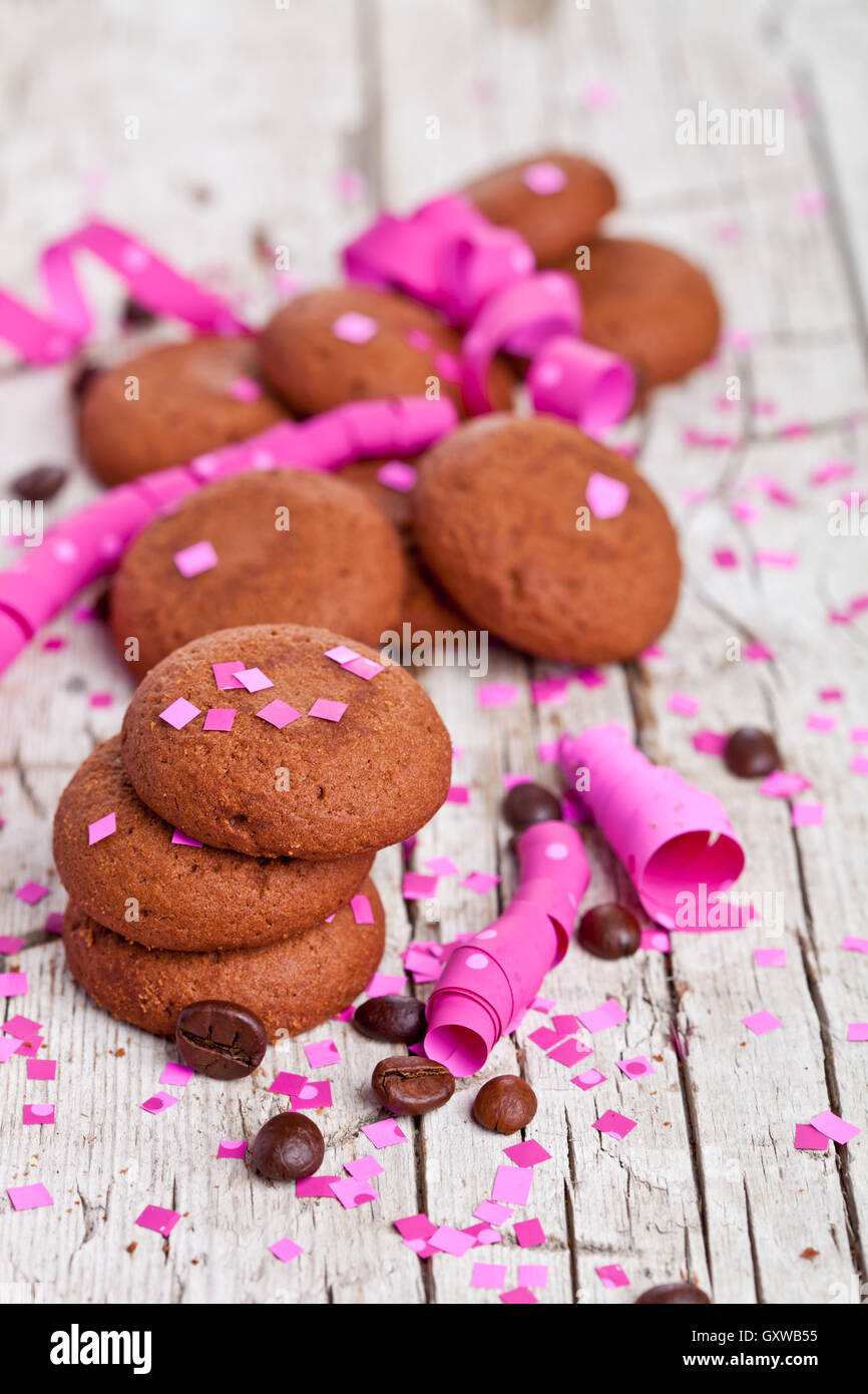 fresh chocolate cookies, coffee beans, pink ribbons and confetti Stock ...