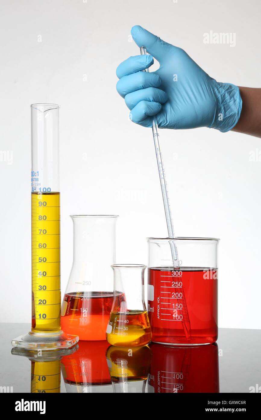Laboratory Glassware and Gloved Hand Stock Photo - Alamy