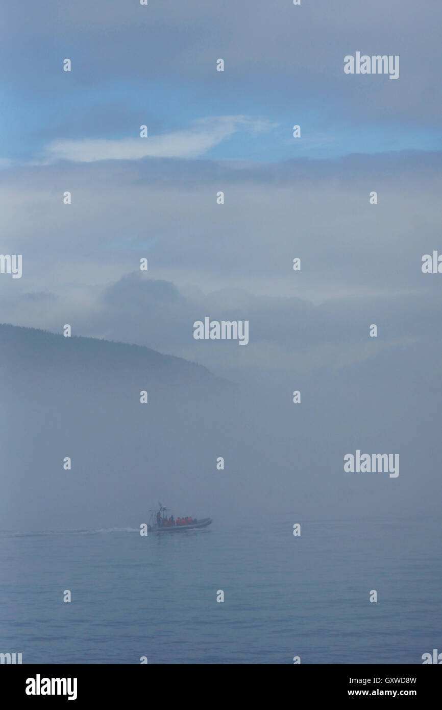 Boat on water in the fog Stock Photo - Alamy