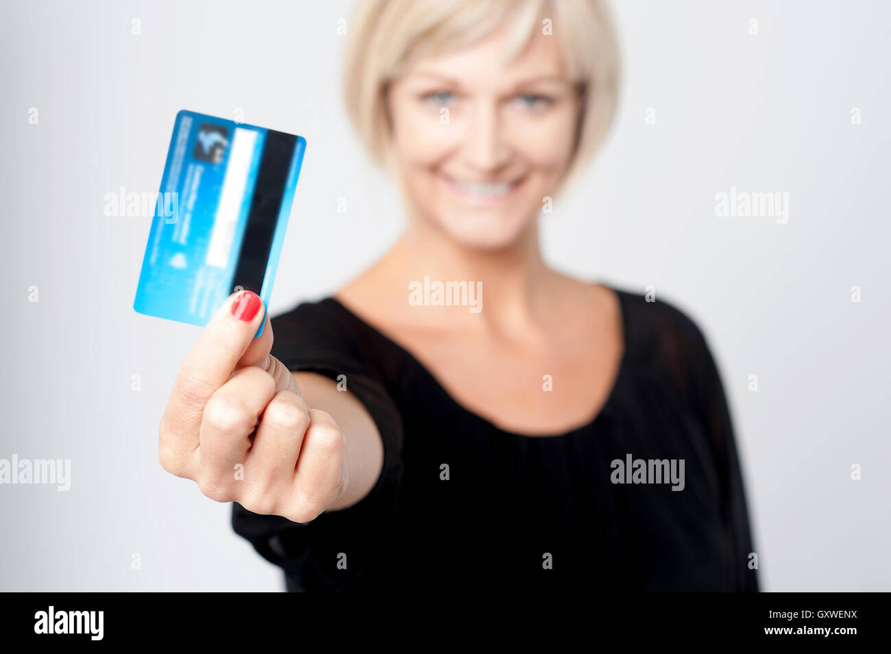 Woman displaying her credit card Stock Photo - Alamy
