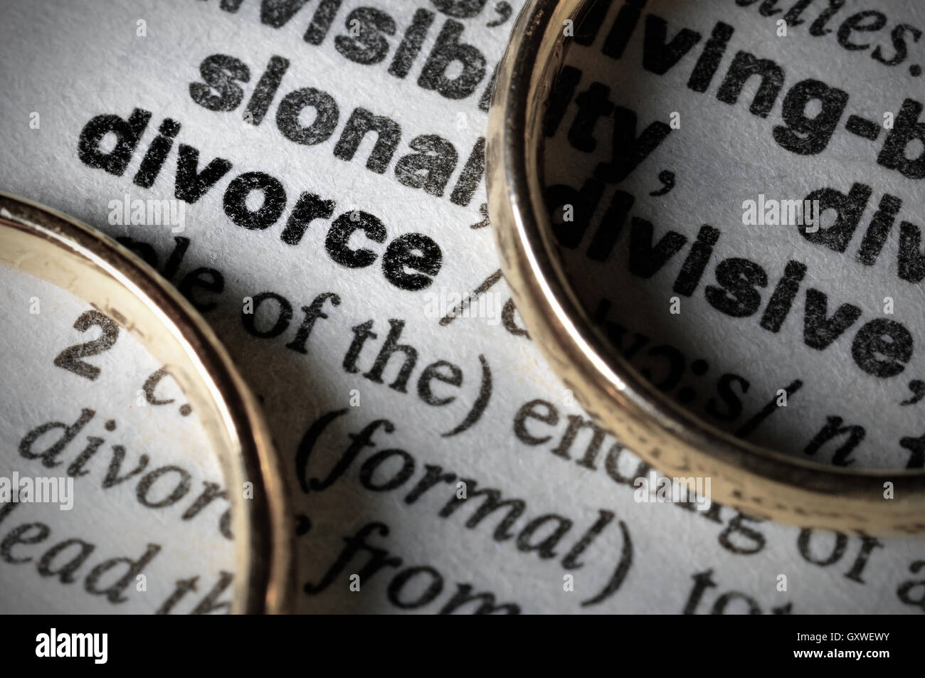 Two separate wedding rings next to word hi-res stock photography and ...