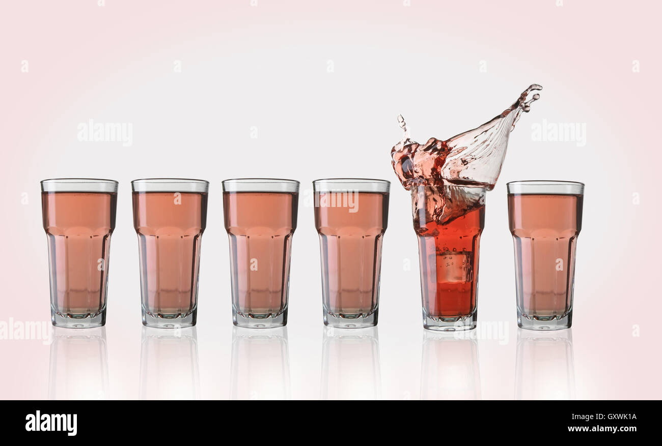 Cocktail splash with ice cube on pink background. Perfect for bar Stock ...