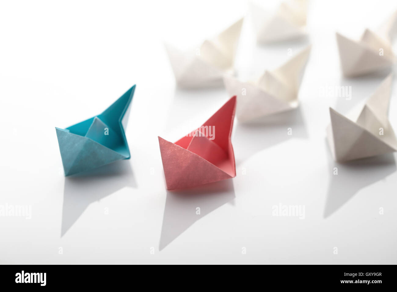Origami paper ship on white background Stock Photo - Alamy