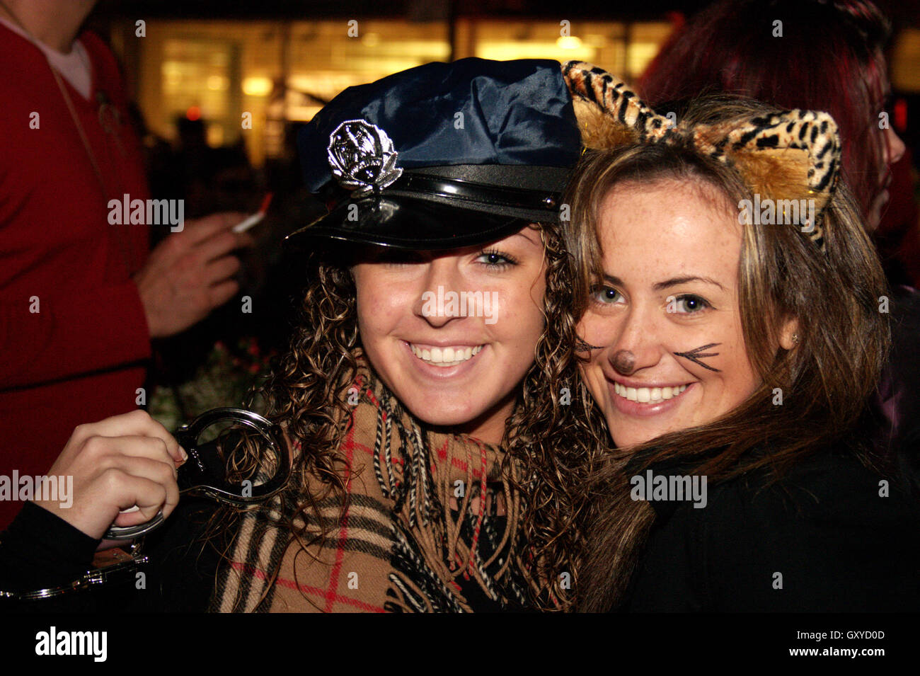 Portrait of two young women watching a Halloween parade in New York ...