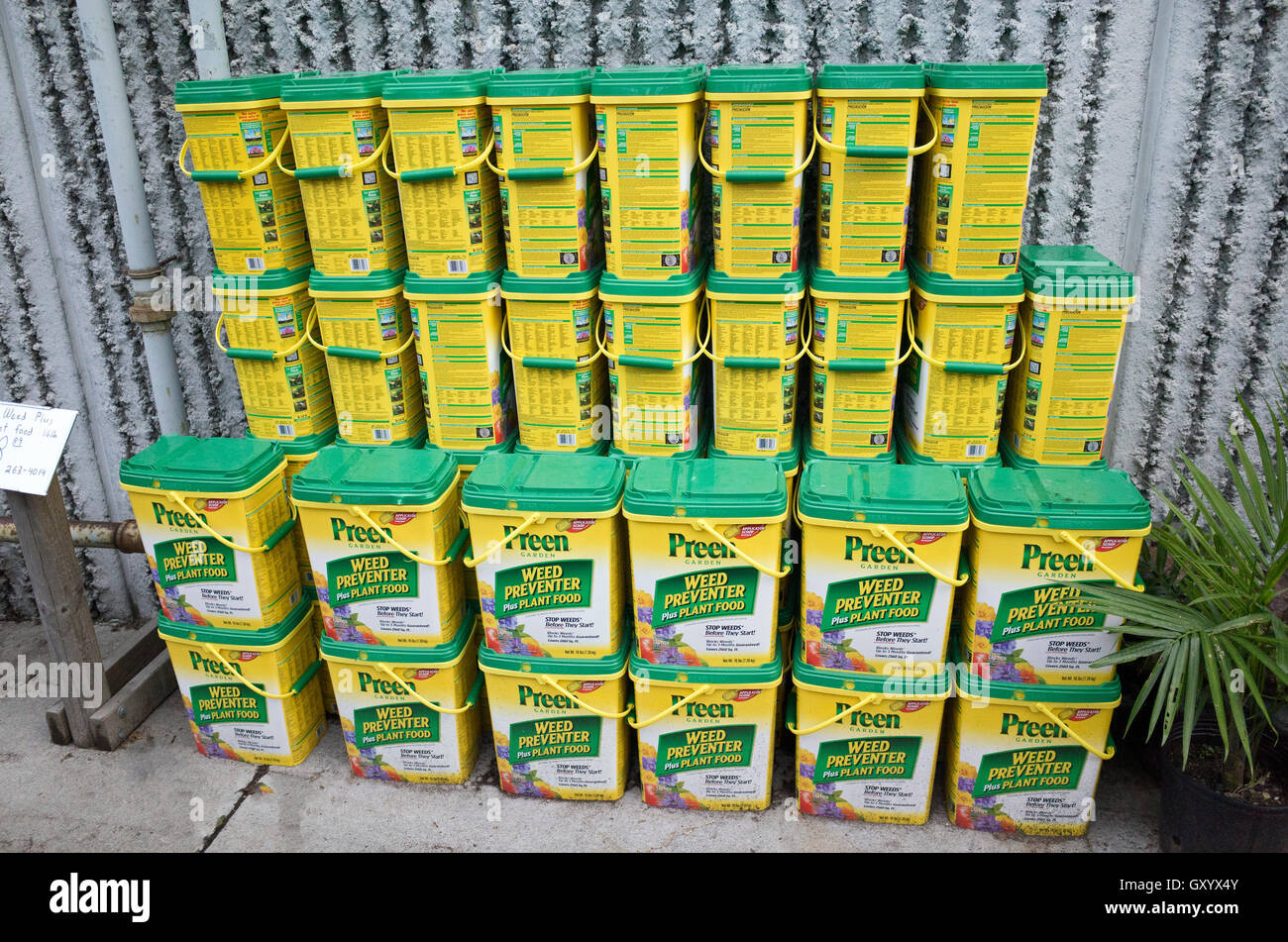 Artistically arranged stack of Preen Weed Preventer in yellow and green ...