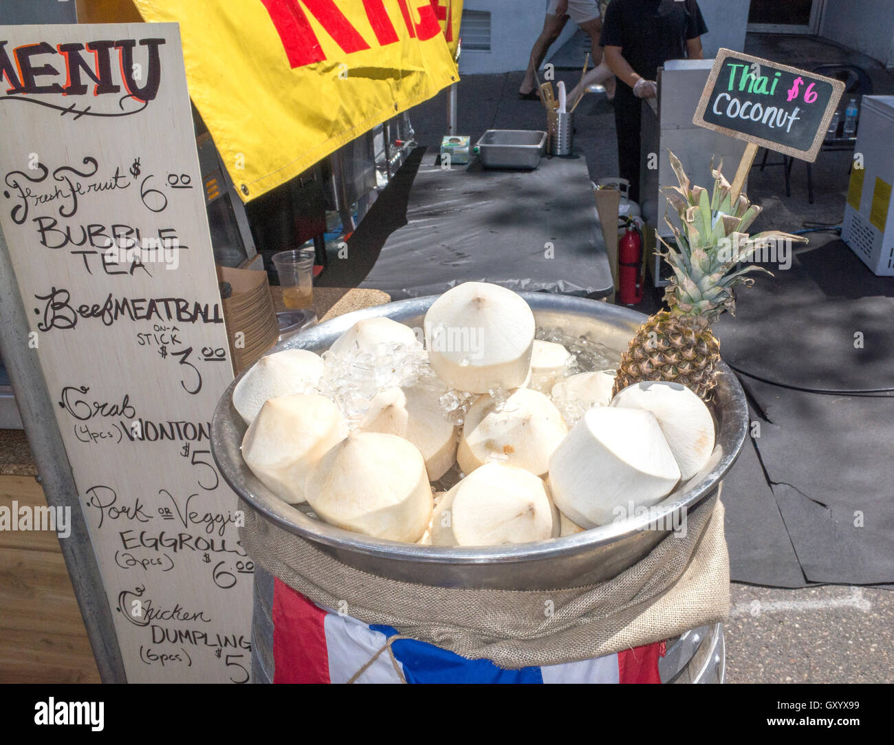 Barrel of coconuts ready to be a base in a delicious Thai umbrella ...