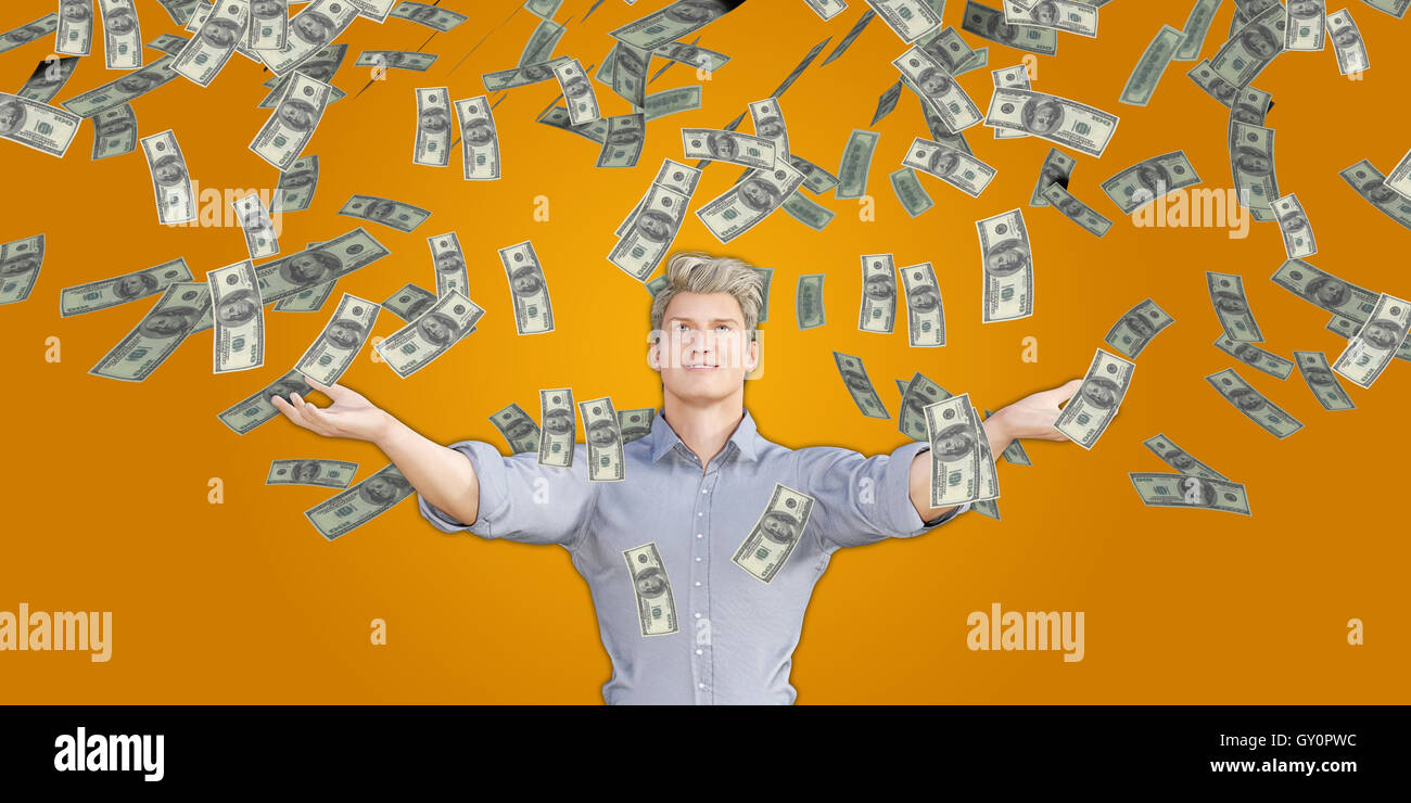 Man Catching Money Falling From the Sky in US Dollars Stock Photo - Alamy