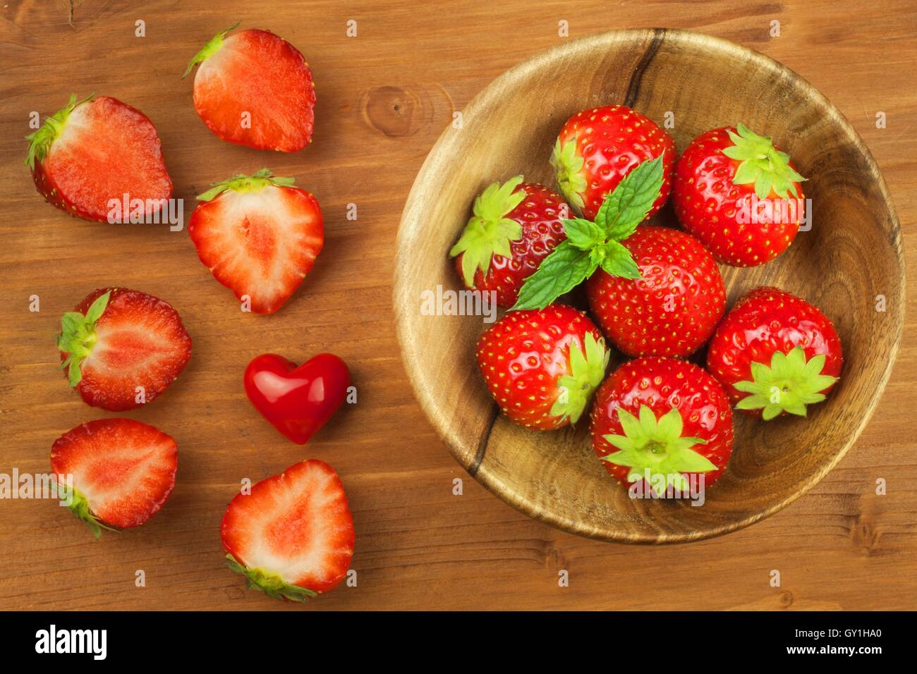 Strawberry on a wooden background. Advertising for the sale of fresh ...