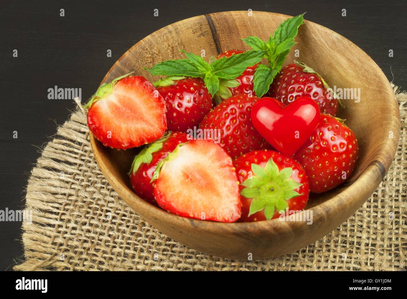 Strawberry on a wooden background. Advertising for the sale of fresh ...
