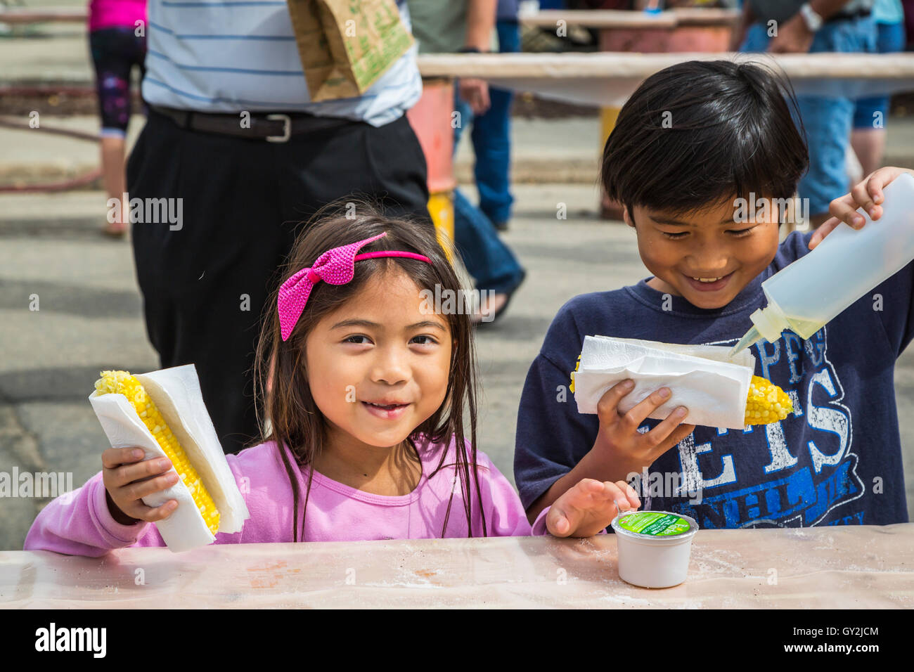 Children eating free corn at the Corn and Apple Festival in Morden ...