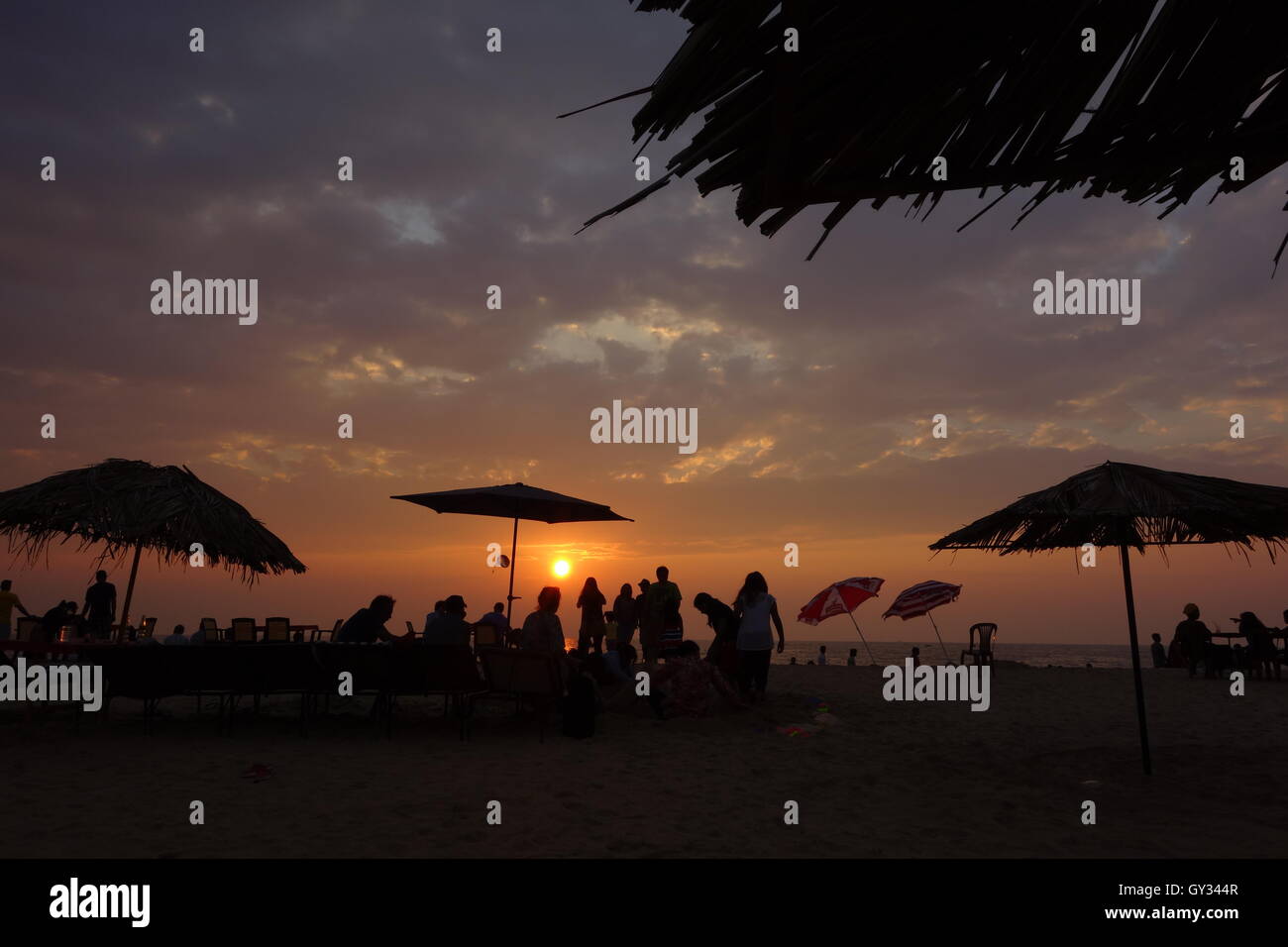 sunset on the beach with people Stock Photo - Alamy