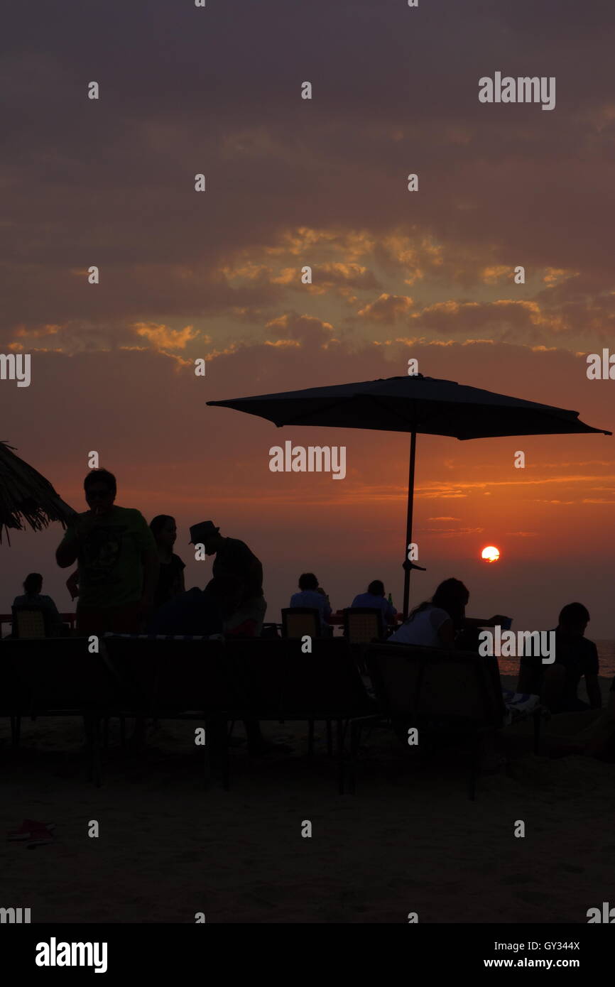 people on the beach at sunset Stock Photo - Alamy