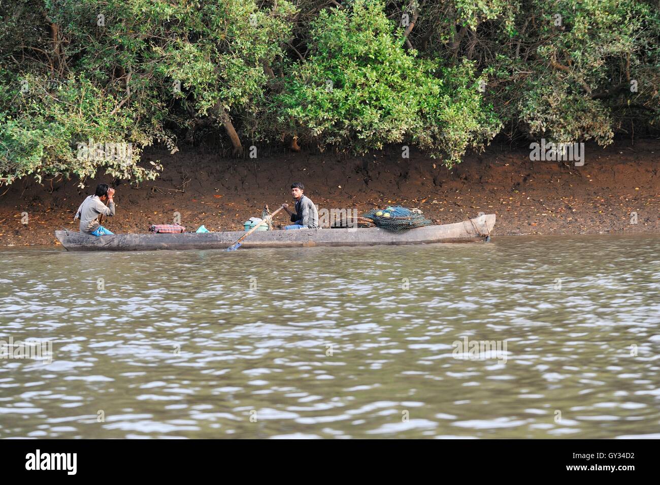 Boatmen in the river Stock Photo - Alamy
