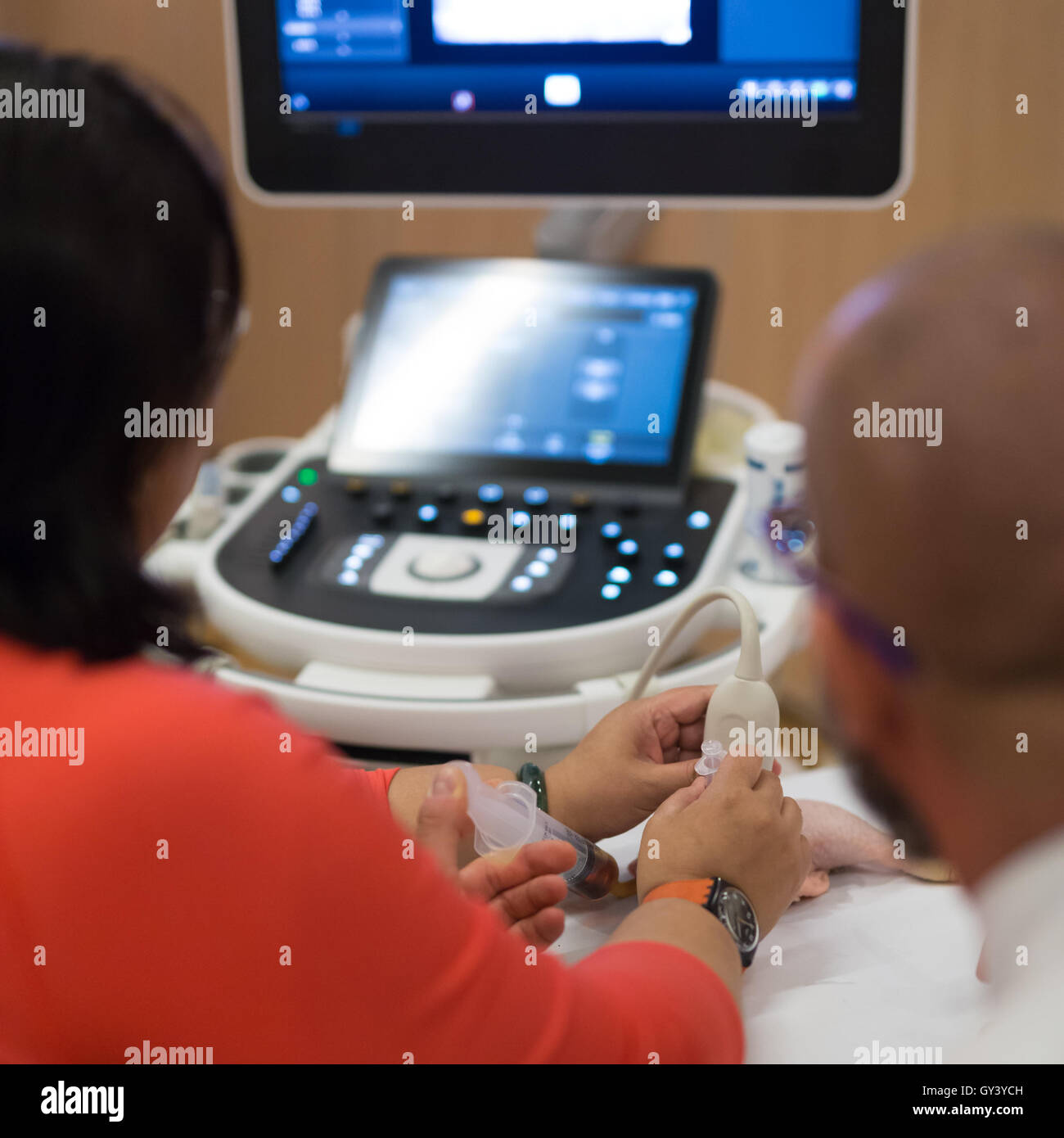 Medical doctor student learning to use ultra sound scanner machine ...