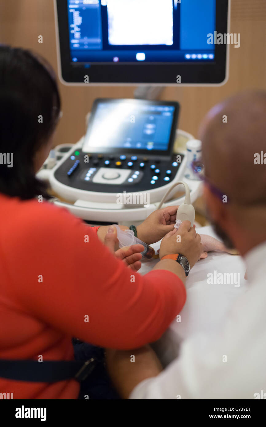 Medical doctor student learning to use ultra sound scanner machine ...