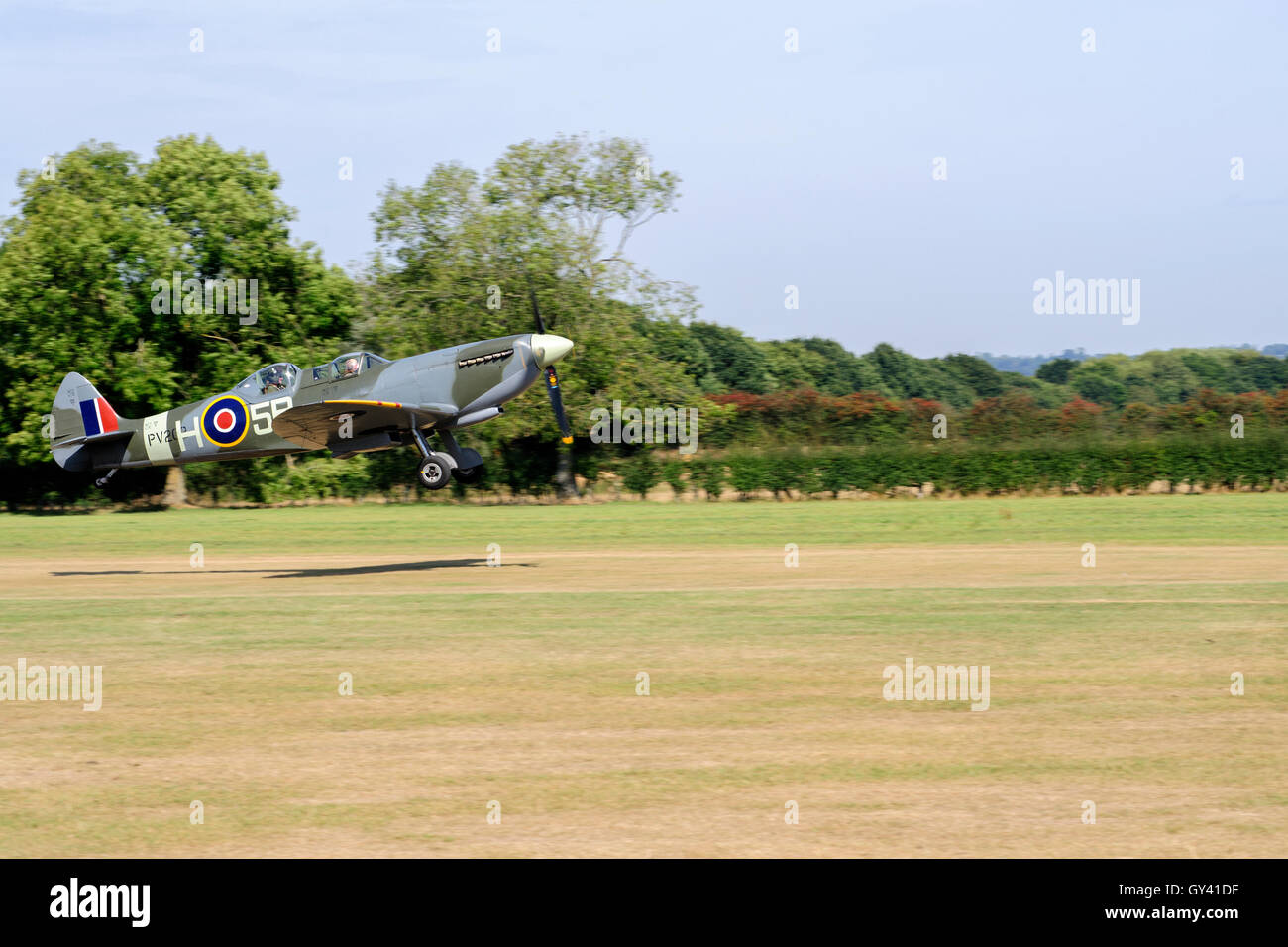 military spitfire trainer aircraft in flight at headcorn airfield in ...