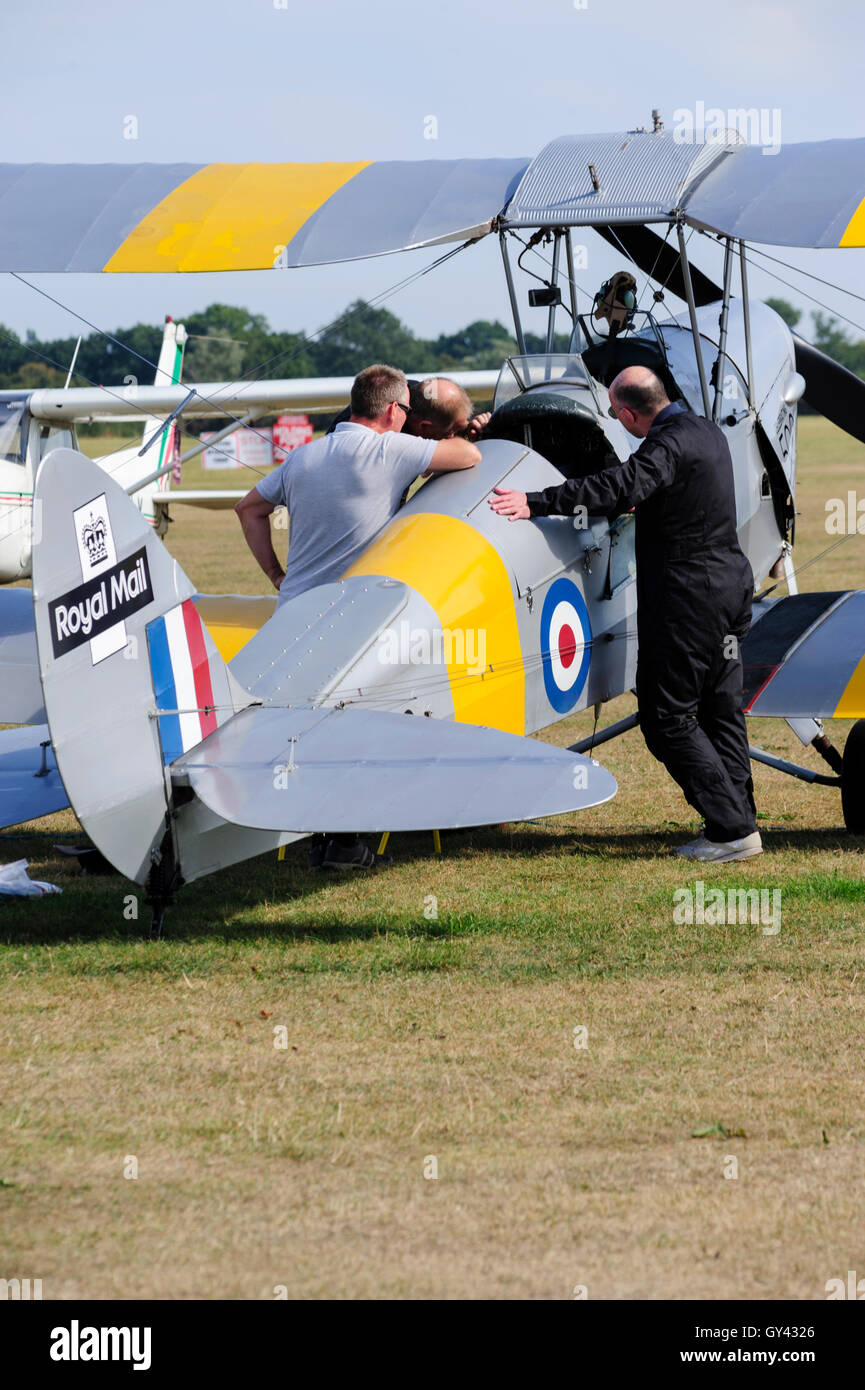 preparing a vintage tiger moth aircraft at headcorn airfield in kent ...