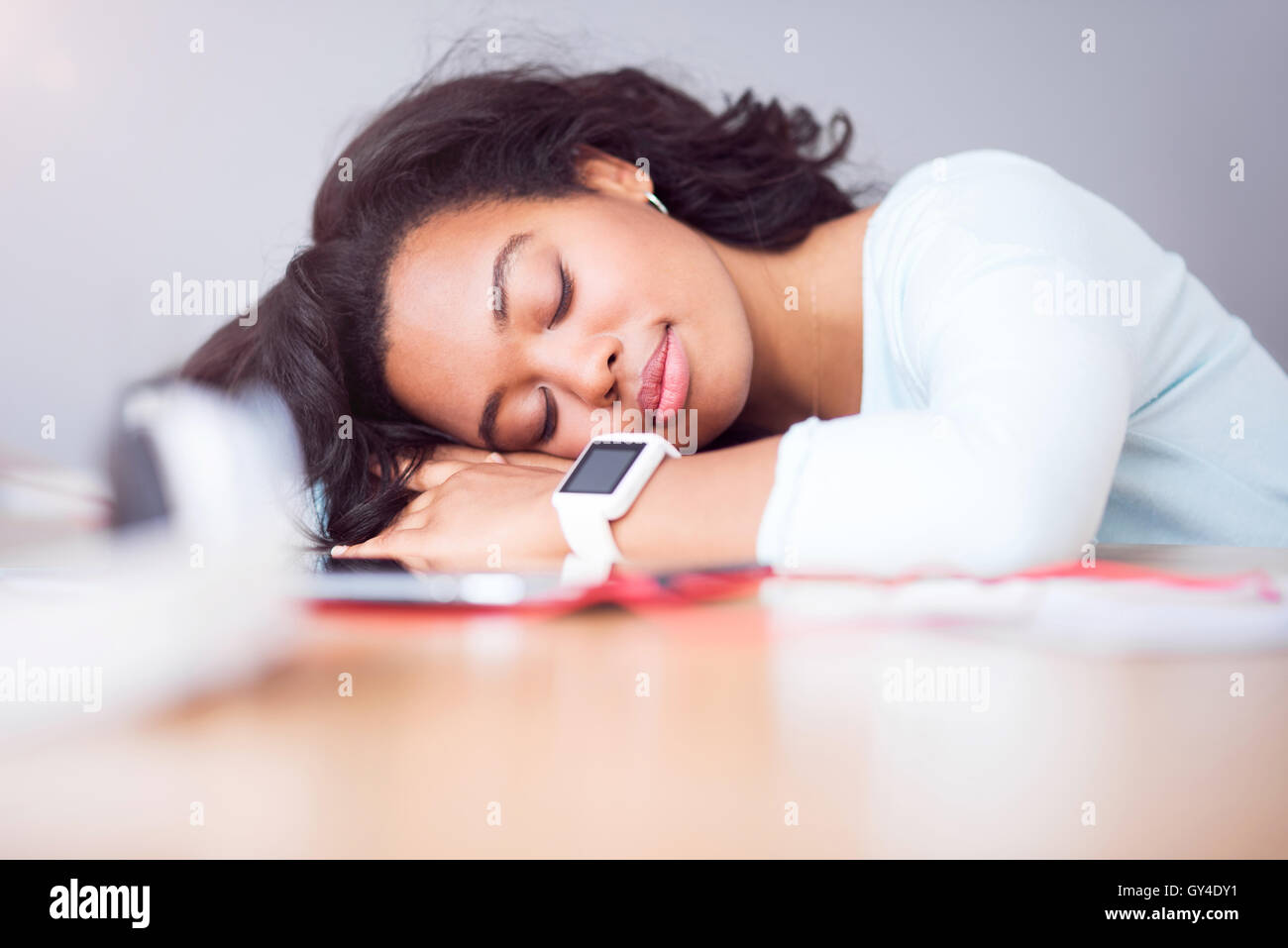 Tired woman sleeping on the surface of table Stock Photo - Alamy