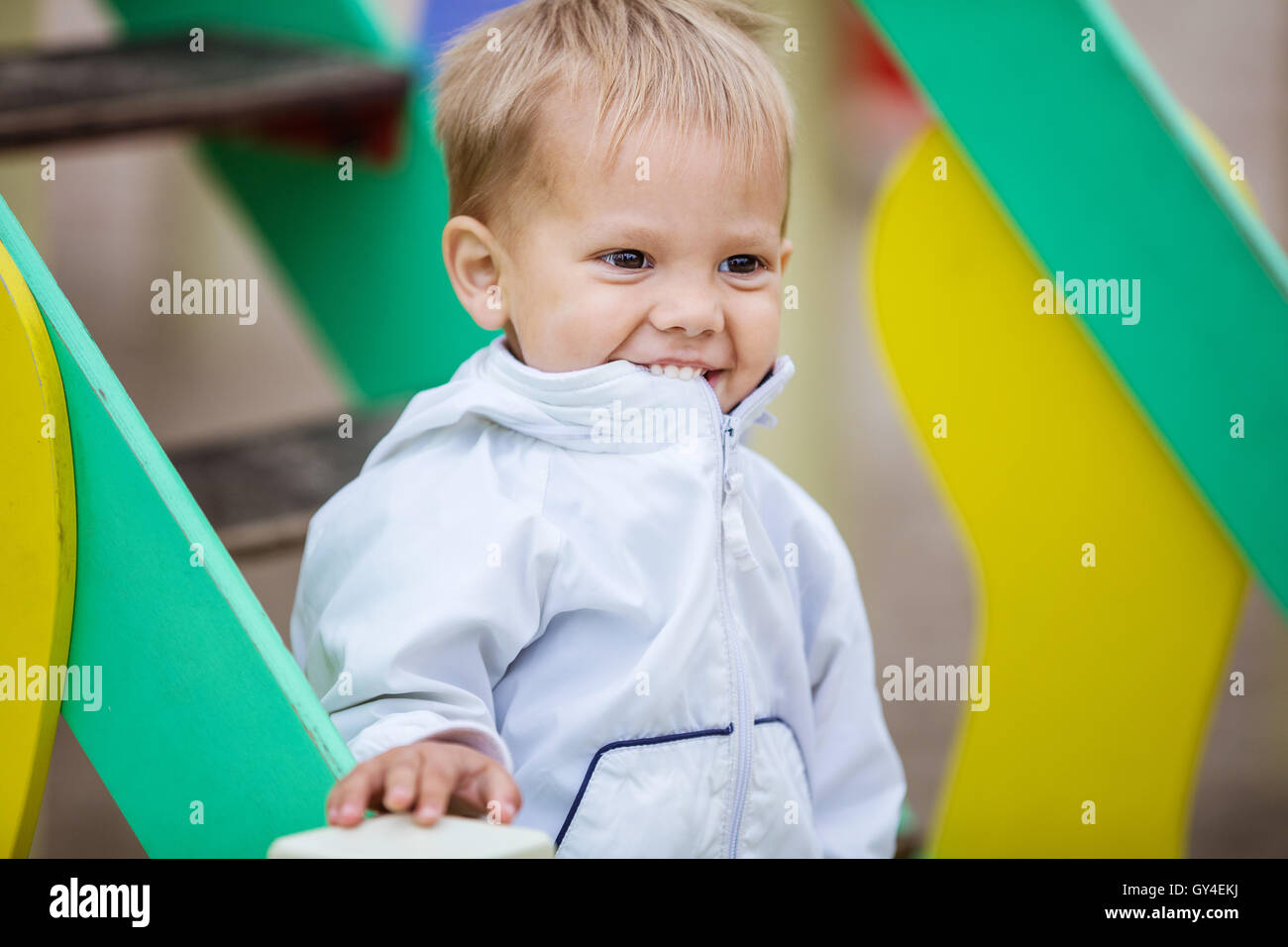 Happy toddler boy on playground Stock Photo - Alamy