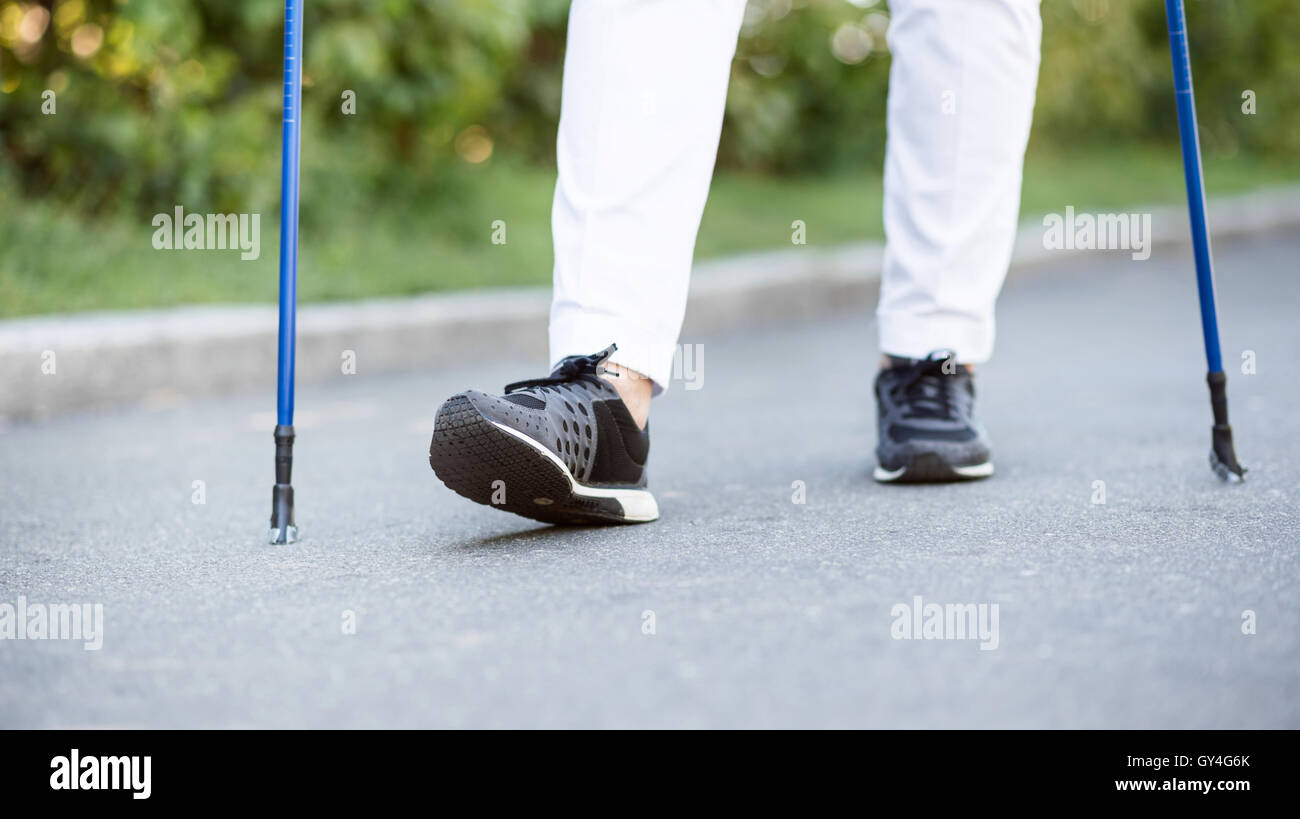 View of female legs while walking in park Stock Photo - Alamy