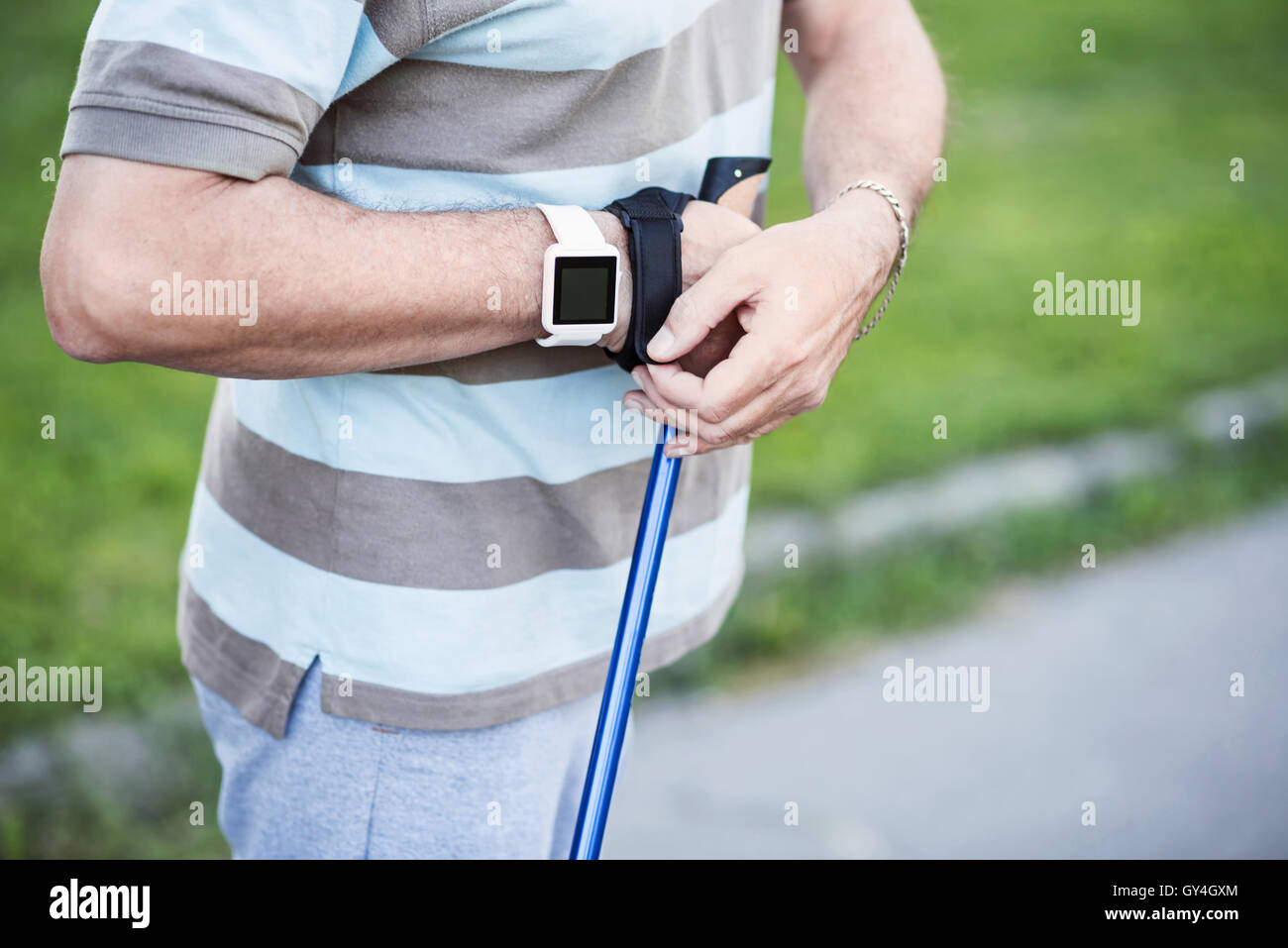Positive old man fixing his sport glove Stock Photo - Alamy