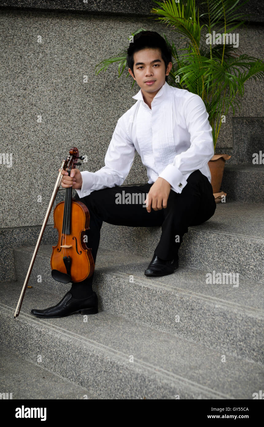 asia man with his violin Stock Photo - Alamy