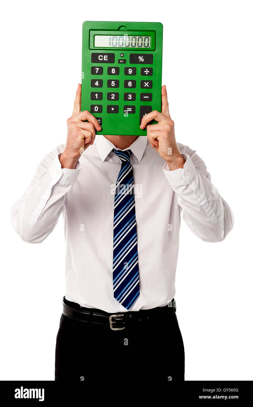 Guy hiding his face behind big calculator Stock Photo - Alamy