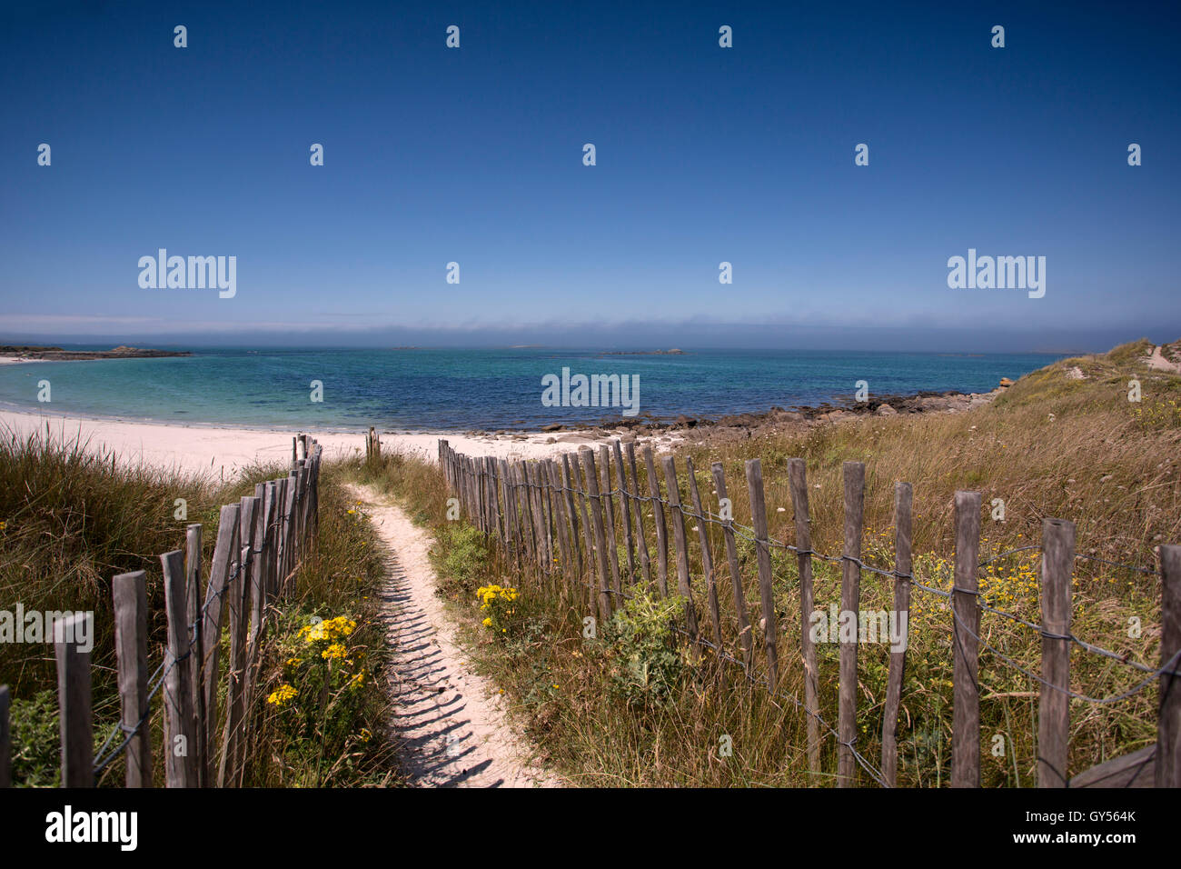 Beach with Path and Fence in Brittany France on a sunny day in summer ...