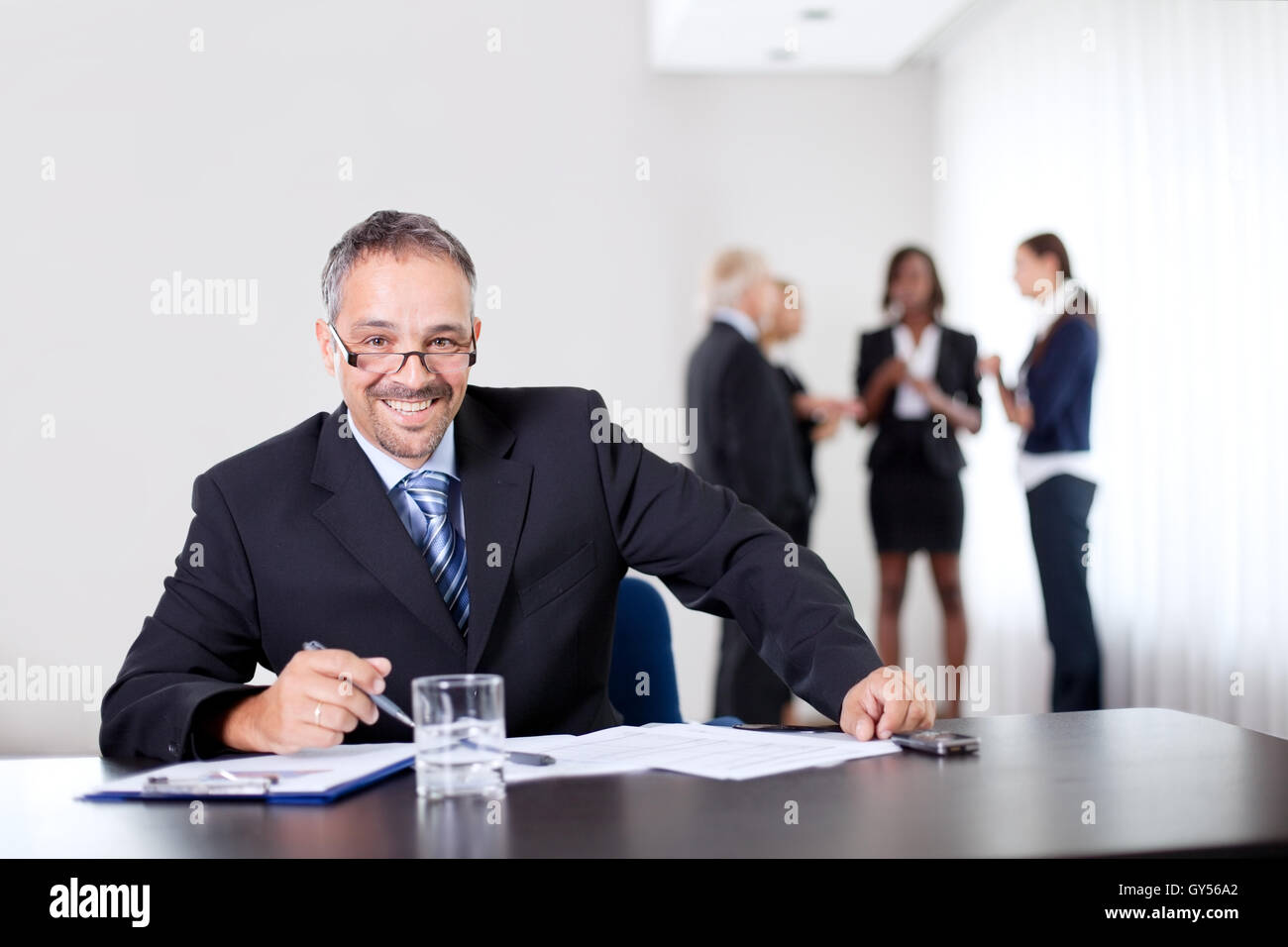 Closeup portrait of a smart businessman smiling Stock Photo - Alamy
