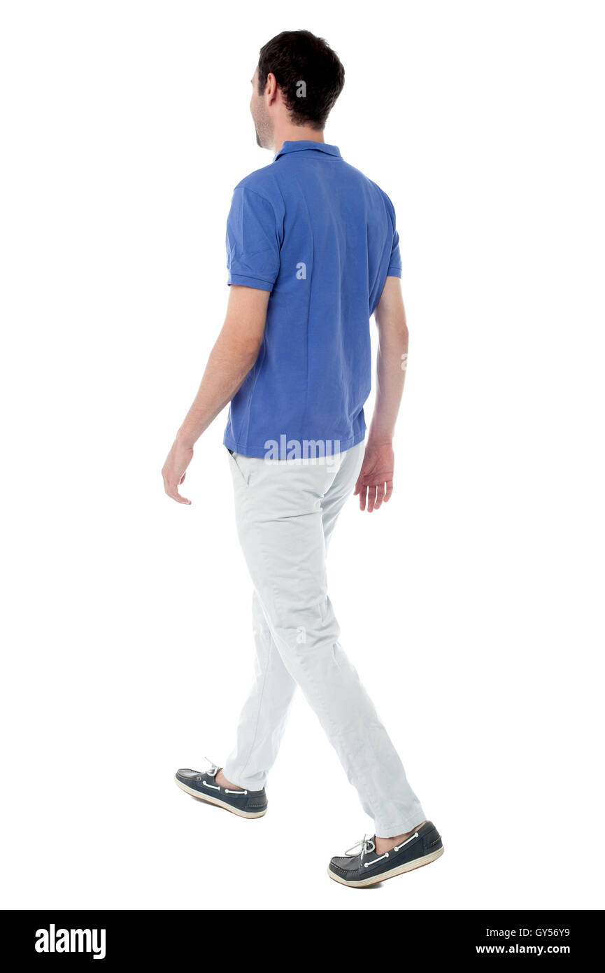 Casual guy walking away from the camera Stock Photo - Alamy