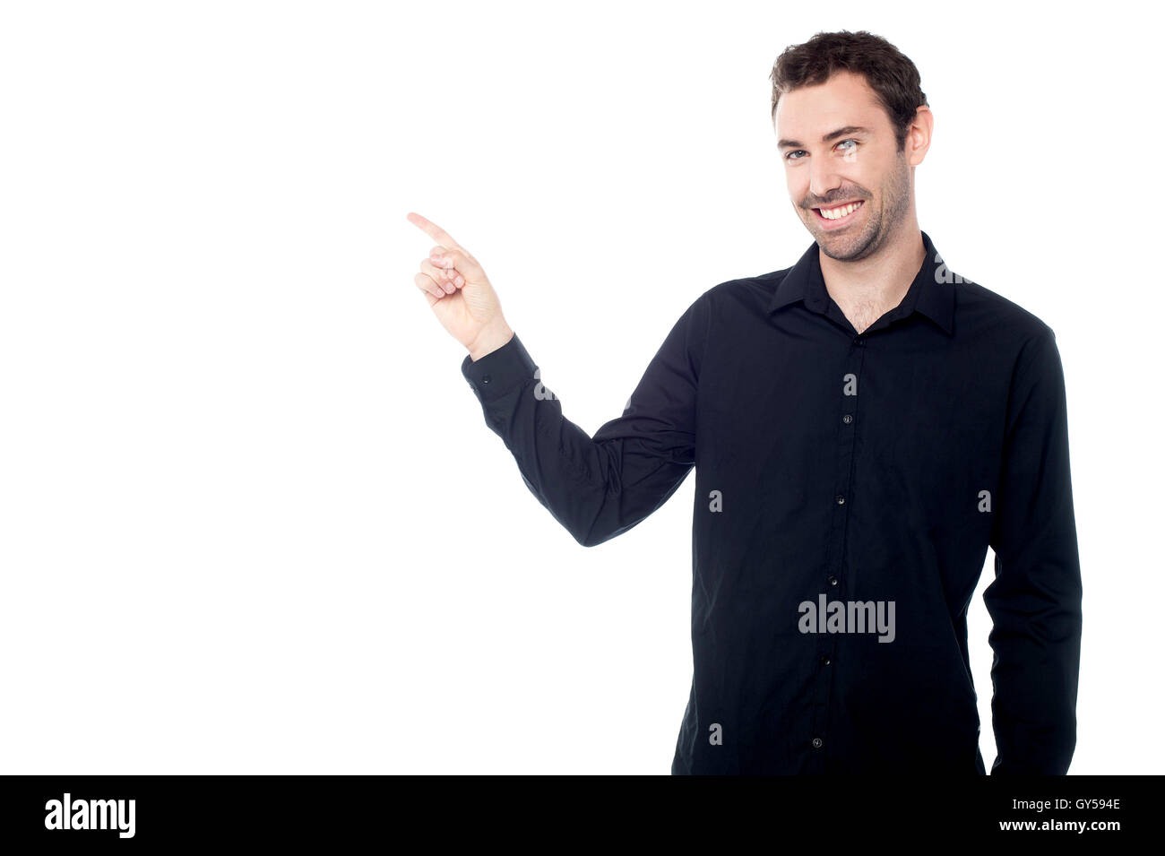 Handsome young guy pointing at something Stock Photo - Alamy