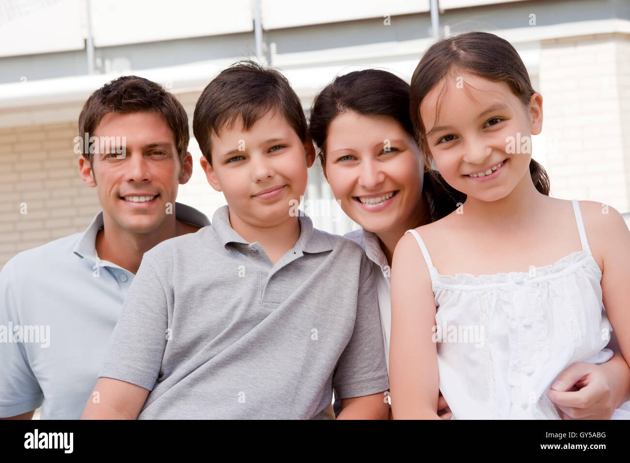 Beautiful young family together - Outdoor Stock Photo - Alamy