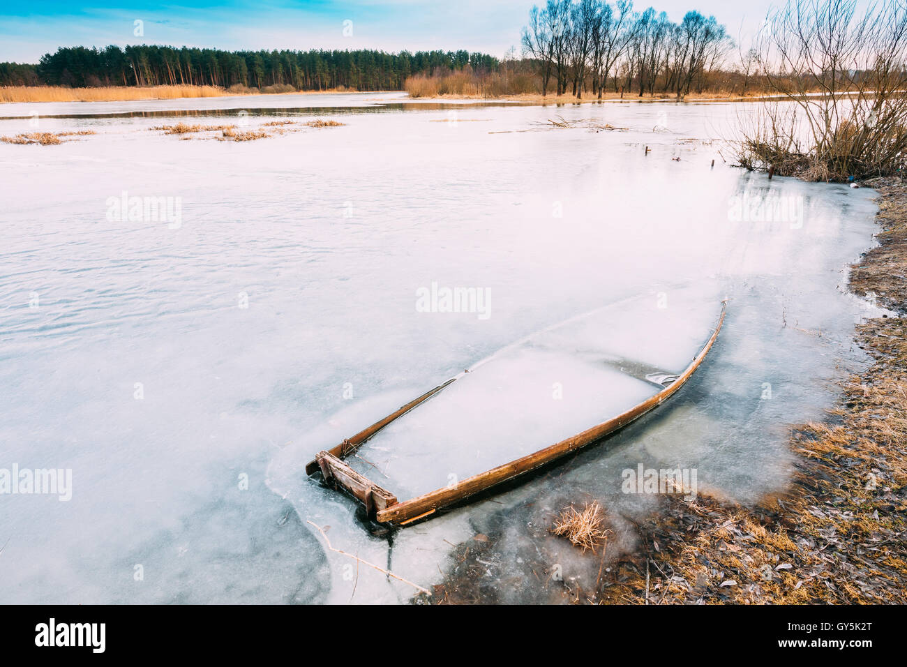 Frozen Into Ice Of River, Lake, Pond Old Wooden Boat. Abandoned Rowing ...