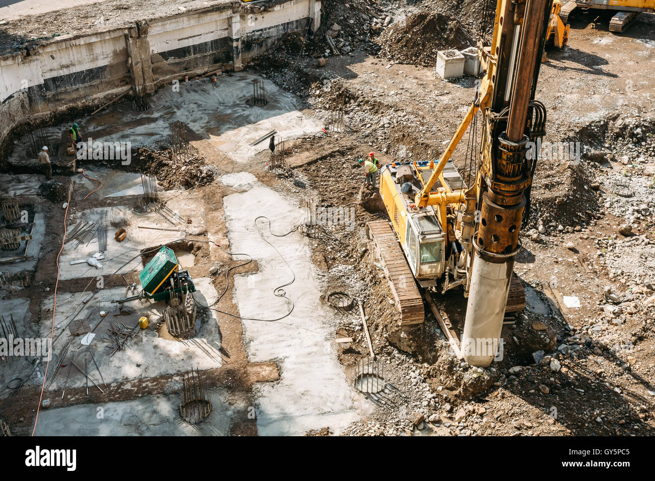 Working Heavy Construction Equipment On A Construction Site. Laying The ...