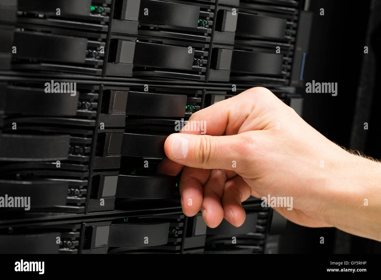 Engineer's Hand Replacing Hard Drive In SAN Storage Stock Photo - Alamy