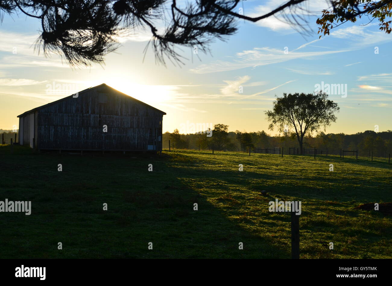 Sunrise behind the barn on the farm Stock Photo - Alamy