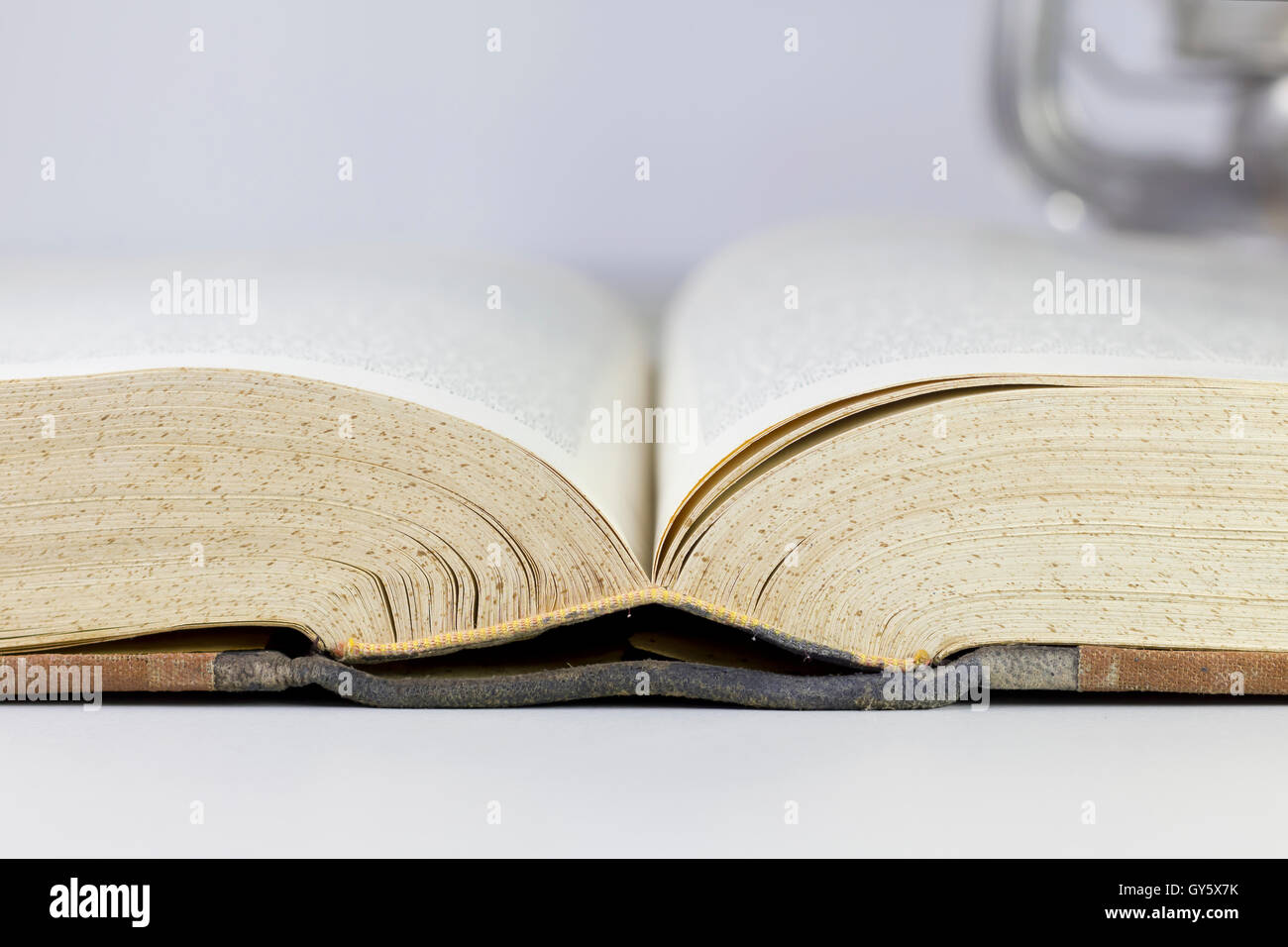 Reading an old book Stock Photo - Alamy