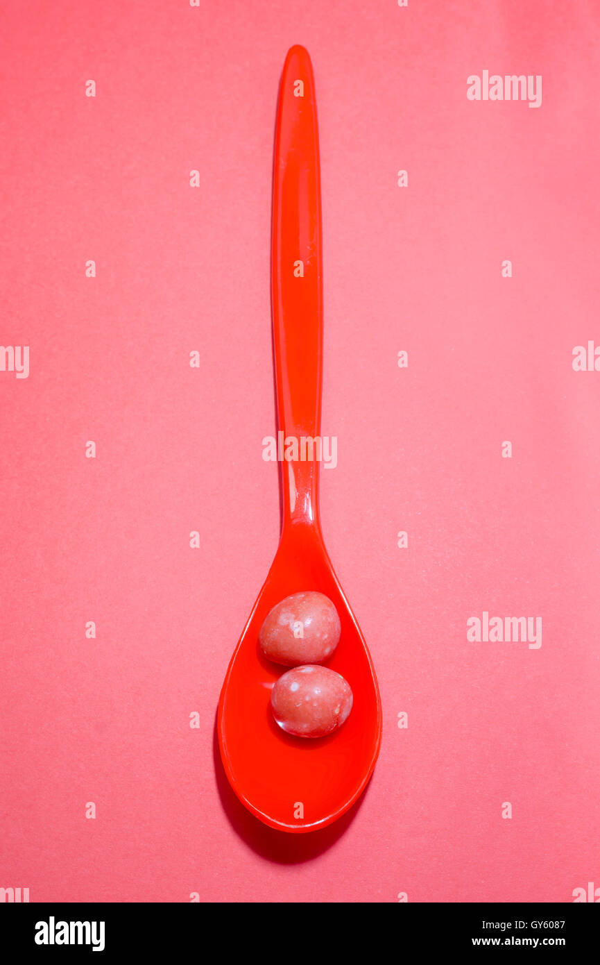 Plastic red spoon hi-res stock photography and images - Alamy
