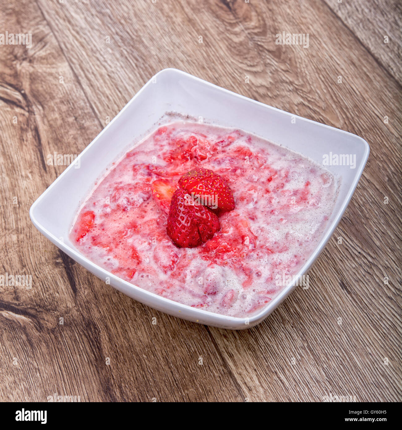 Strawberry puree, decorated with fresh strawberries Stock Photo - Alamy