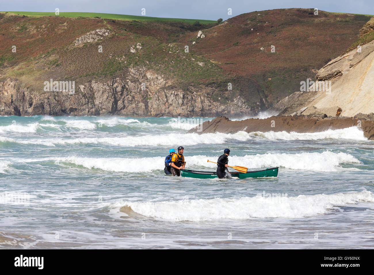 Canoe in the surf at Newgale, Pembrokeshire Stock Photo - Alamy