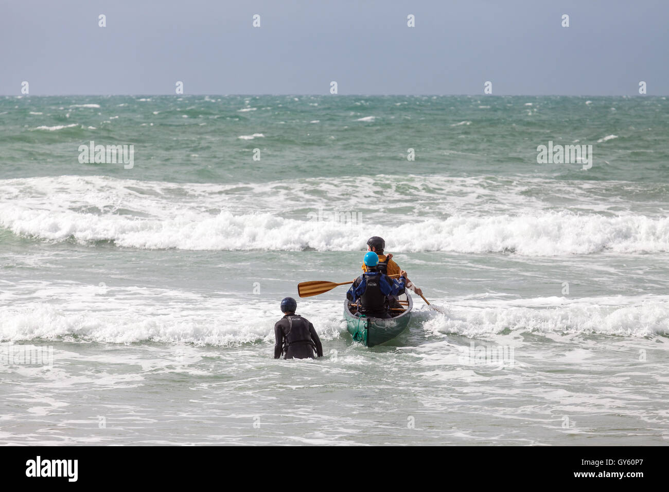 Canoe in the surf at Newgale, Pembrokeshire Stock Photo - Alamy