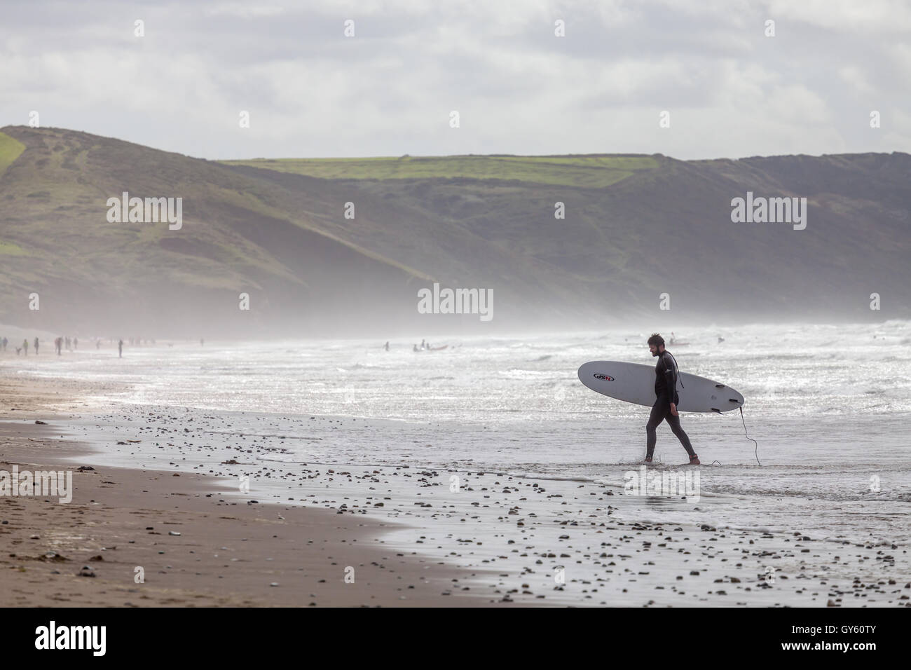 Newgale beach pembrokeshire surfer hi-res stock photography and images ...