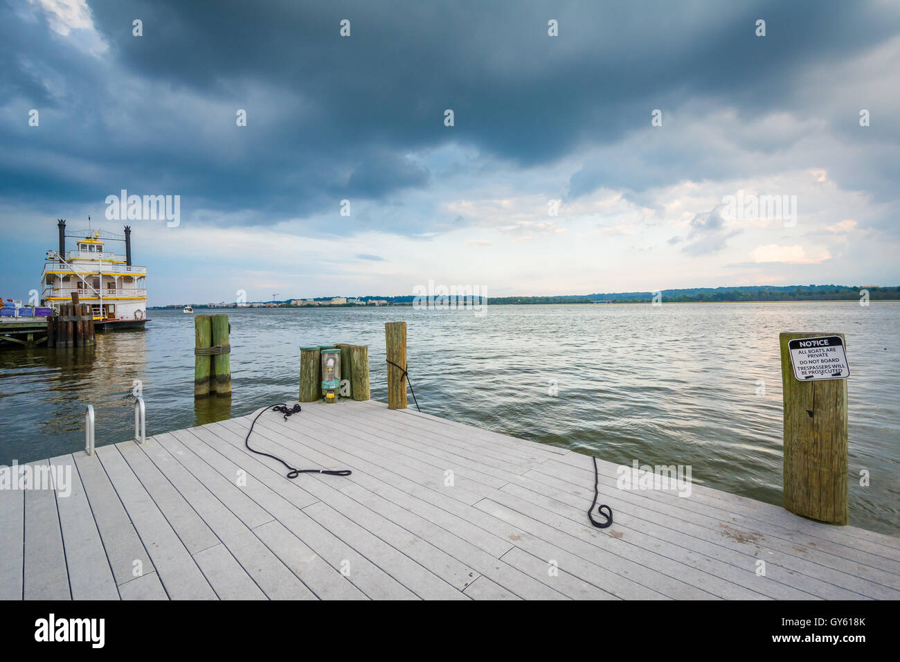 Pier and boat on the Potomac River waterfront, in Alexandria, Virginia ...