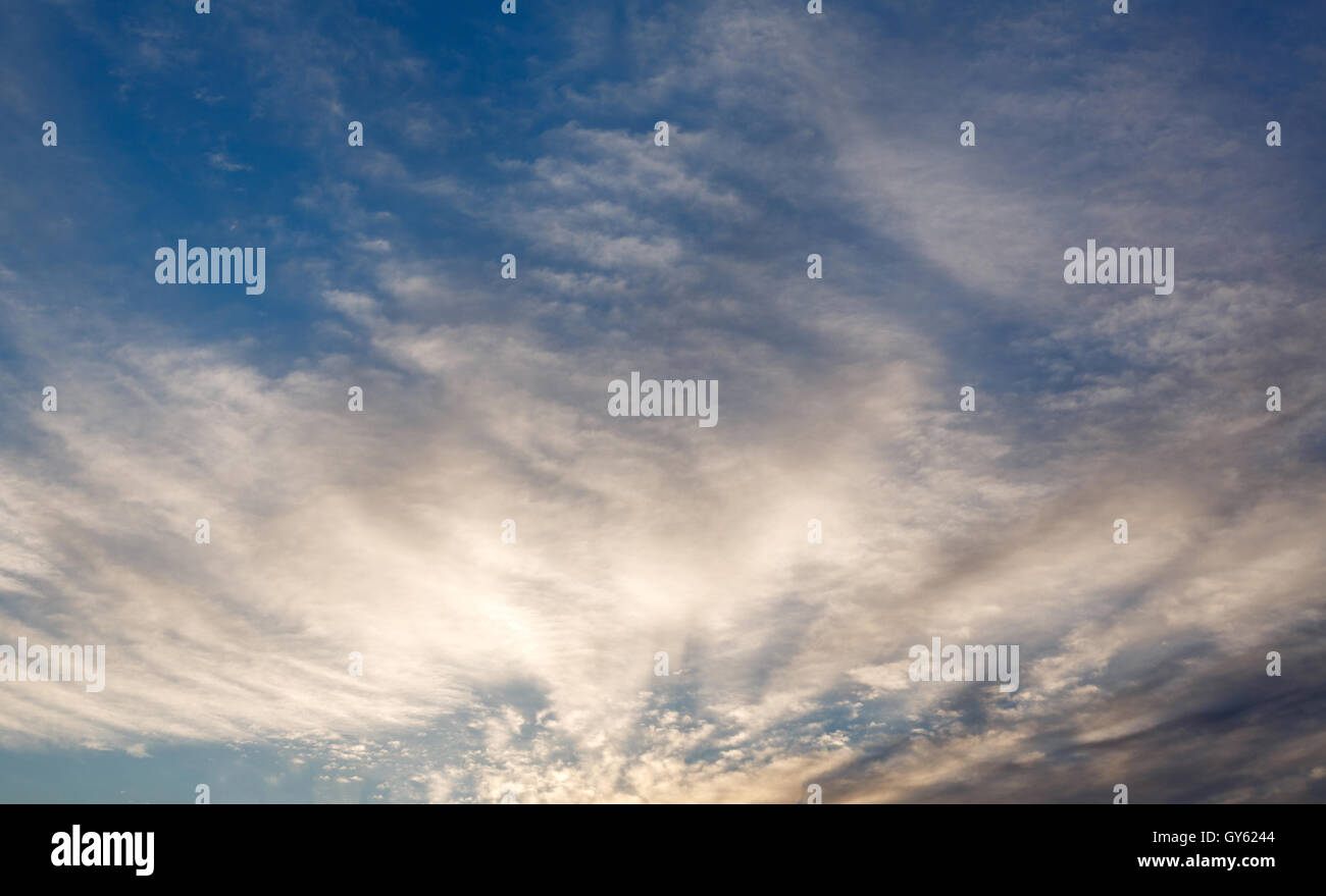 Cumulus clouds against a blue sky. Mostly Cloudy Stock Photo - Alamy