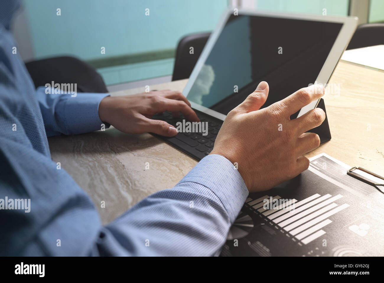 Businessman hand working concept. Documents finance graphic chart ...