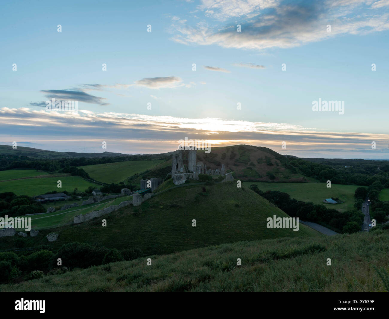 Landscape depicting late summer sunset at Corfe Castle, Dorset, UK ...