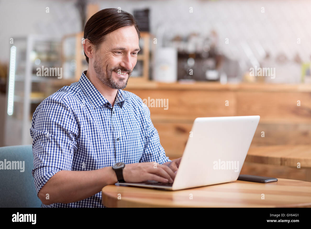 Handsome man using computer Stock Photo - Alamy