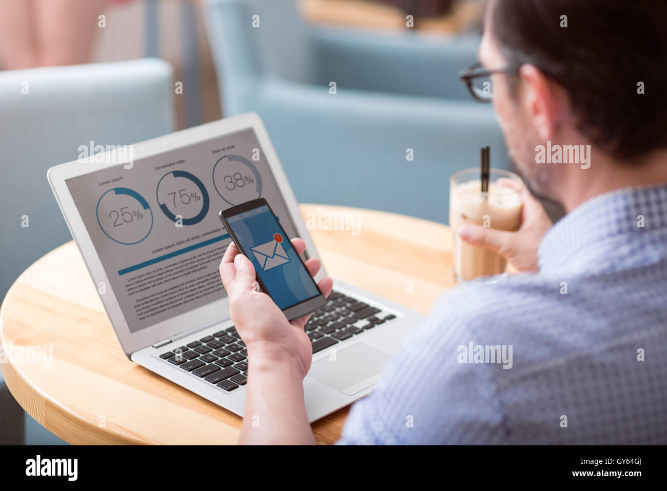 Handsome man working in the cafe Stock Photo - Alamy