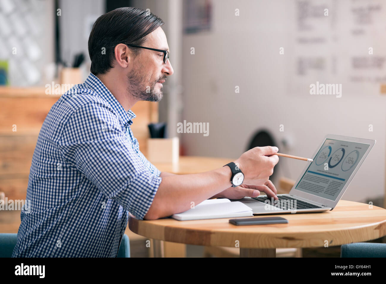 Handsome man working indoors Stock Photo - Alamy