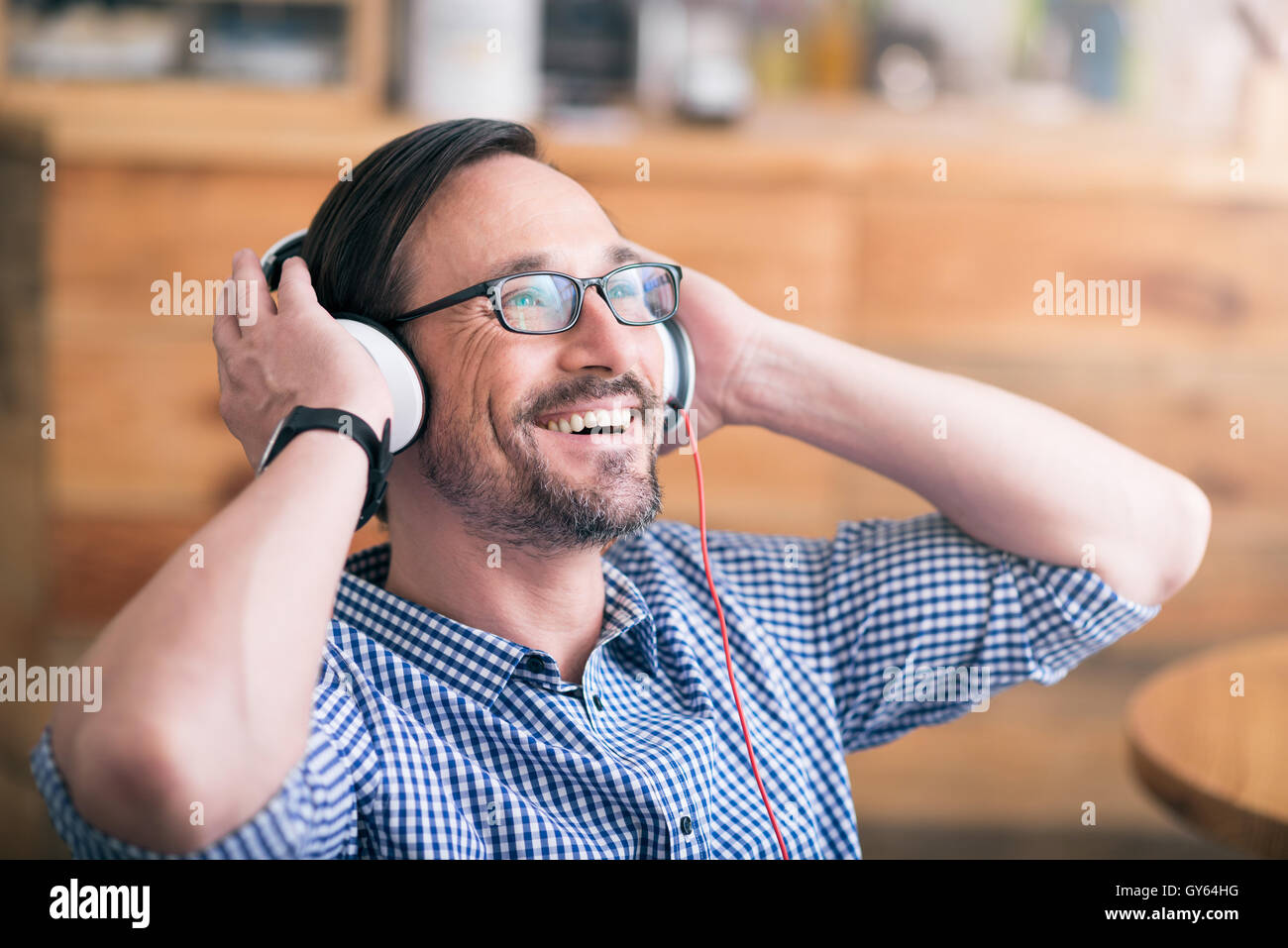 Nice man relaxing in the cafe Stock Photo - Alamy